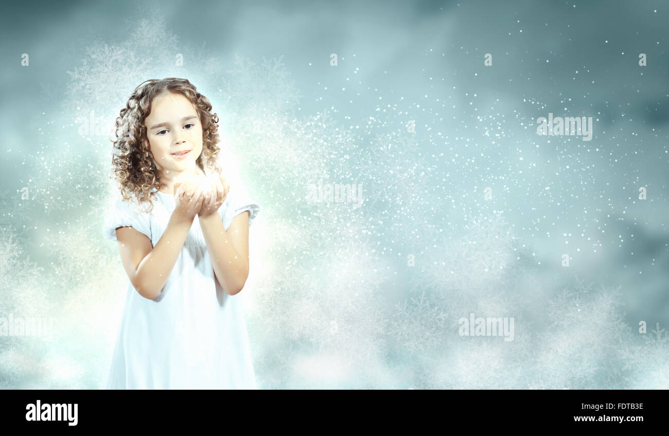 Little girl with magic lights and shining around Stock Photo - Alamy