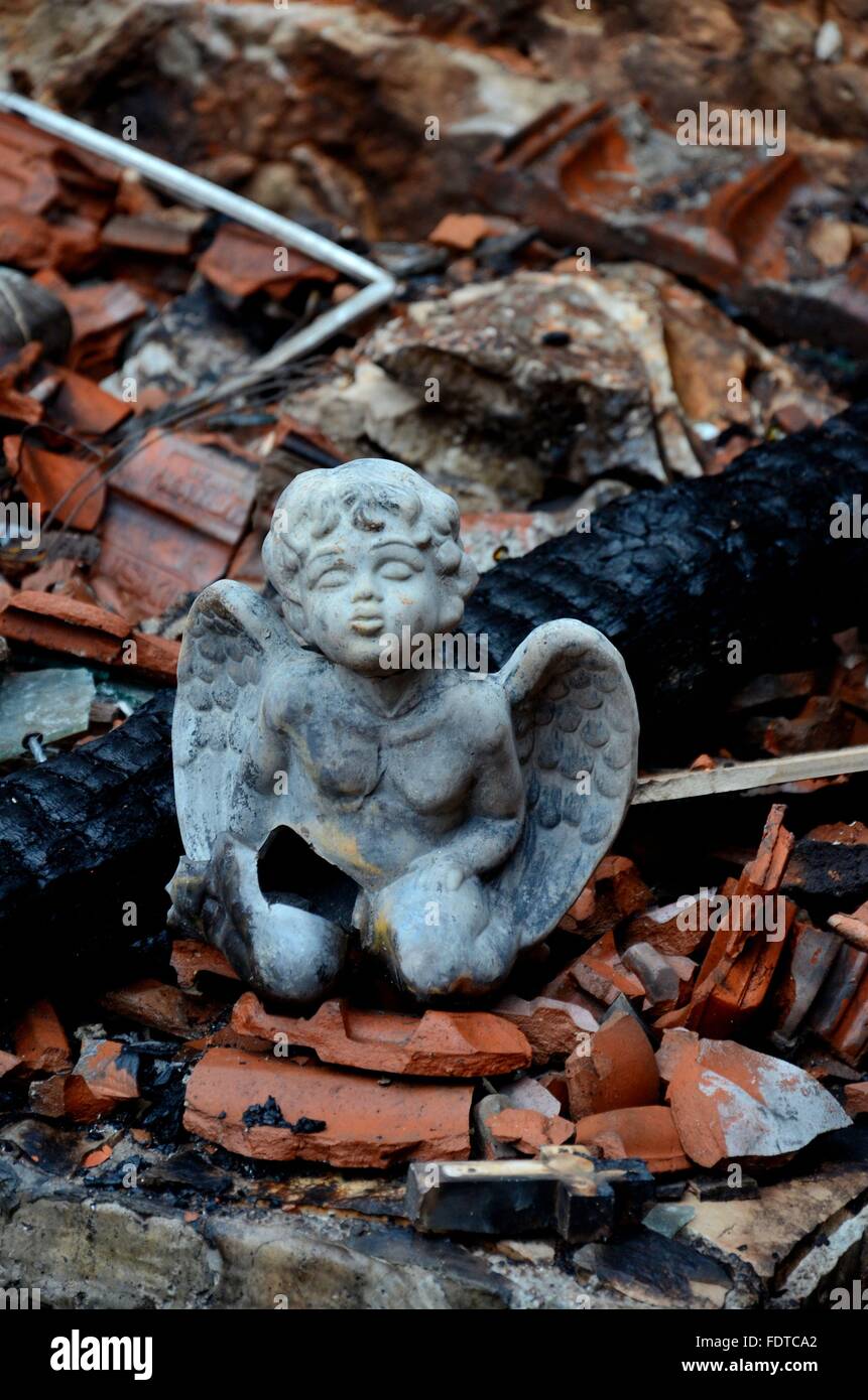 Catholic Christian angel statue with cross in rubble Medjugorje ...