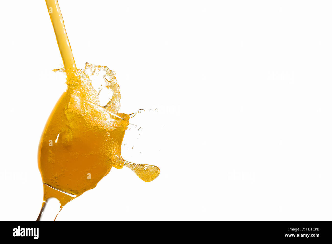 Juice splash isolated on white Stock Photo - Alamy