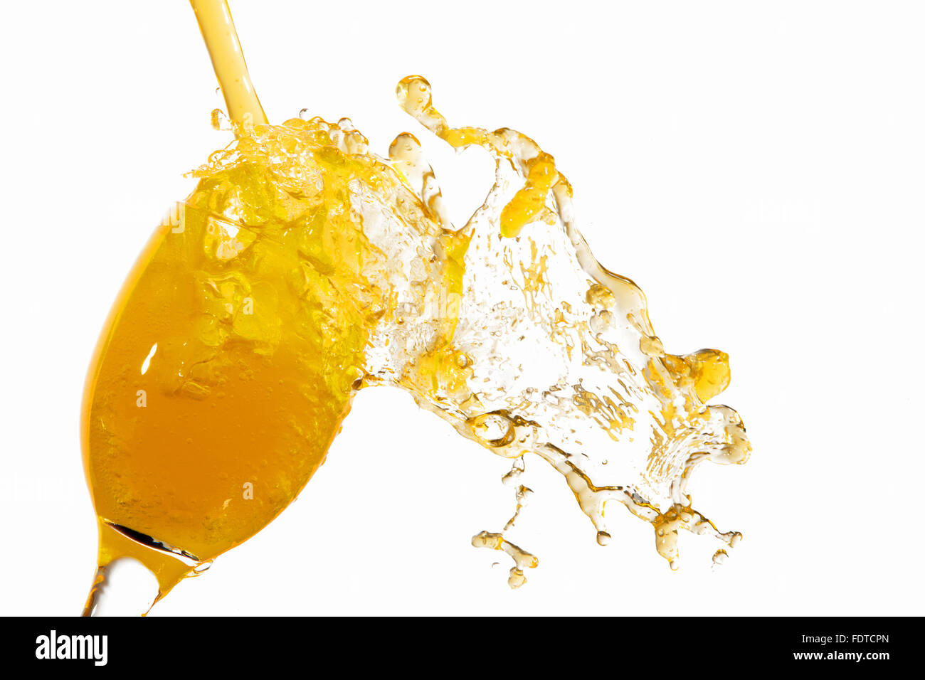 Juice splash isolated on white Stock Photo - Alamy