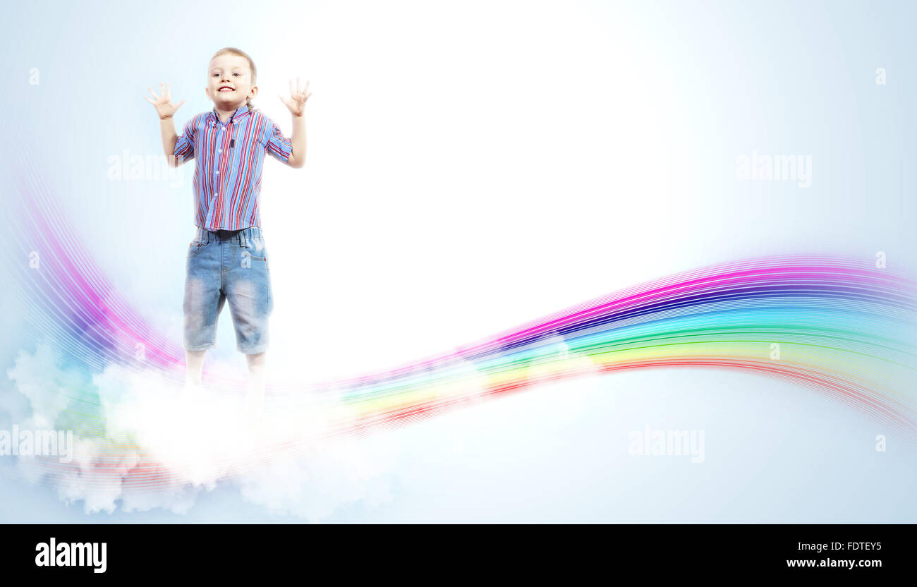 Photo of little boy jumping and raising hands Stock Photo - Alamy