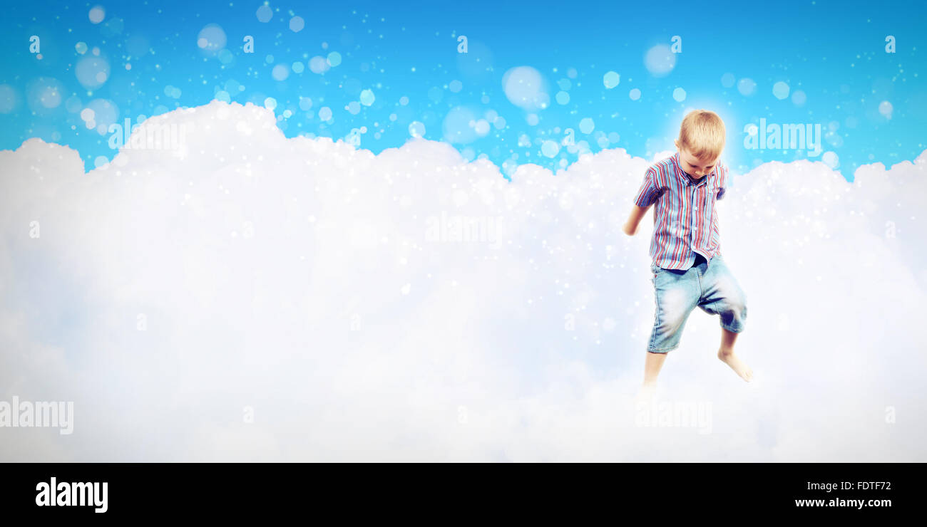 Photo of little boy jumping and raising hands Stock Photo - Alamy