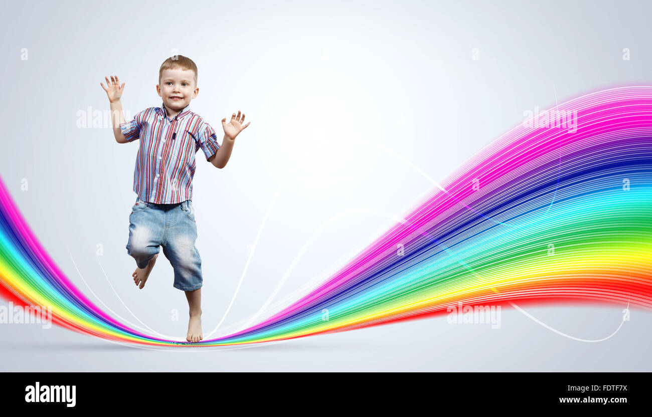 Photo of little boy jumping and raising hands Stock Photo - Alamy