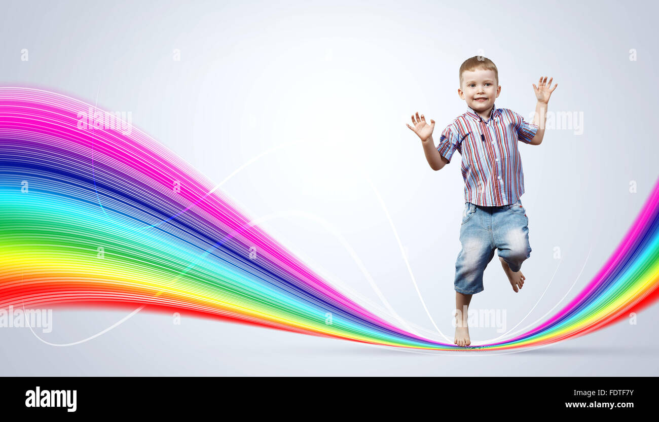 Photo of little boy jumping and raising hands Stock Photo - Alamy