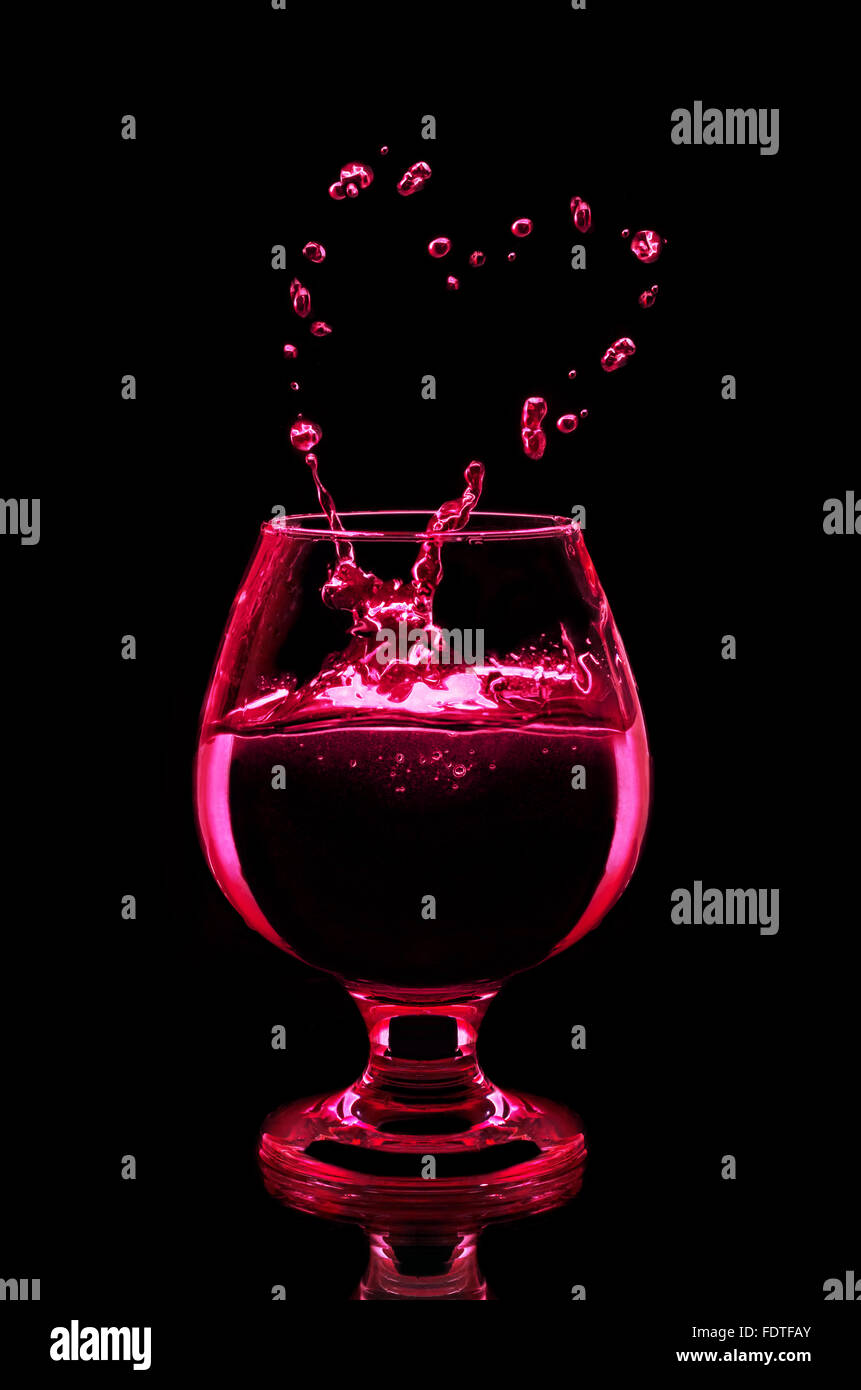 Cocktail in glass on black background Stock Photo - Alamy
