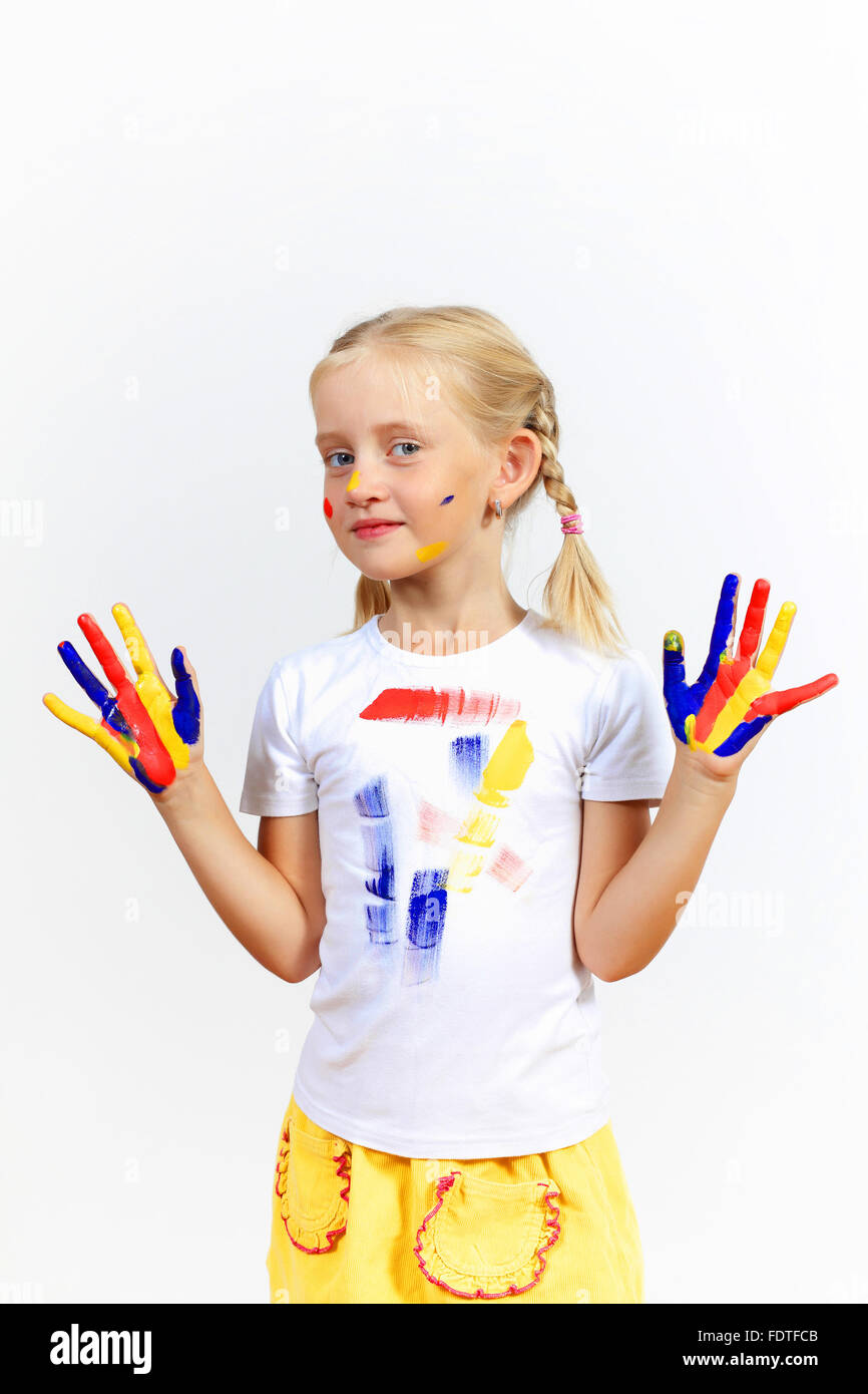 little child with hands painted in colorful paints ready for hand ...