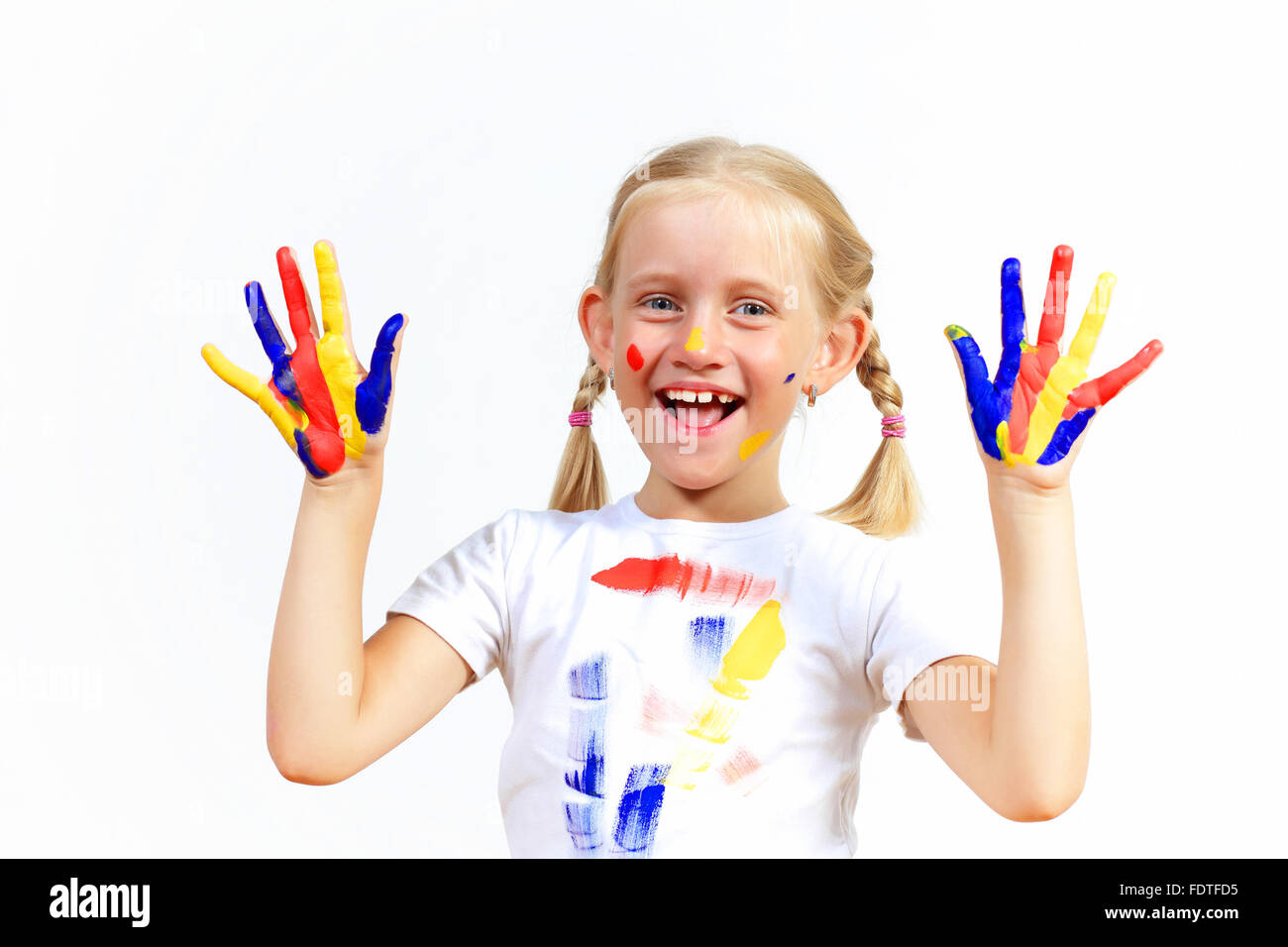 little child with hands painted in colorful paints ready for hand ...
