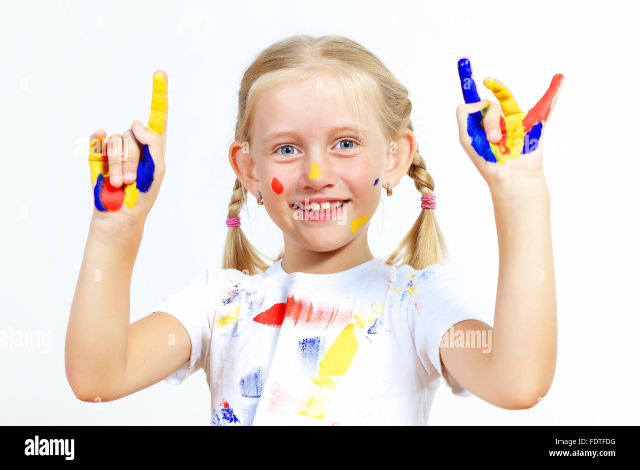little child with hands painted in colorful paints ready for hand ...