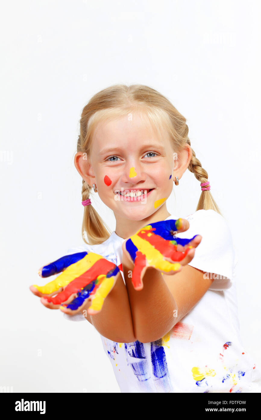 little child with hands painted in colorful paints ready for hand ...