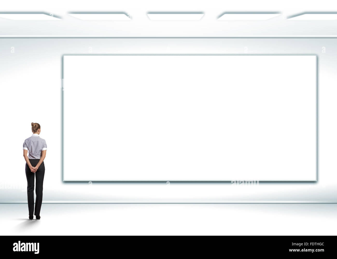 Business person standing near a white blank billboard Stock Photo - Alamy