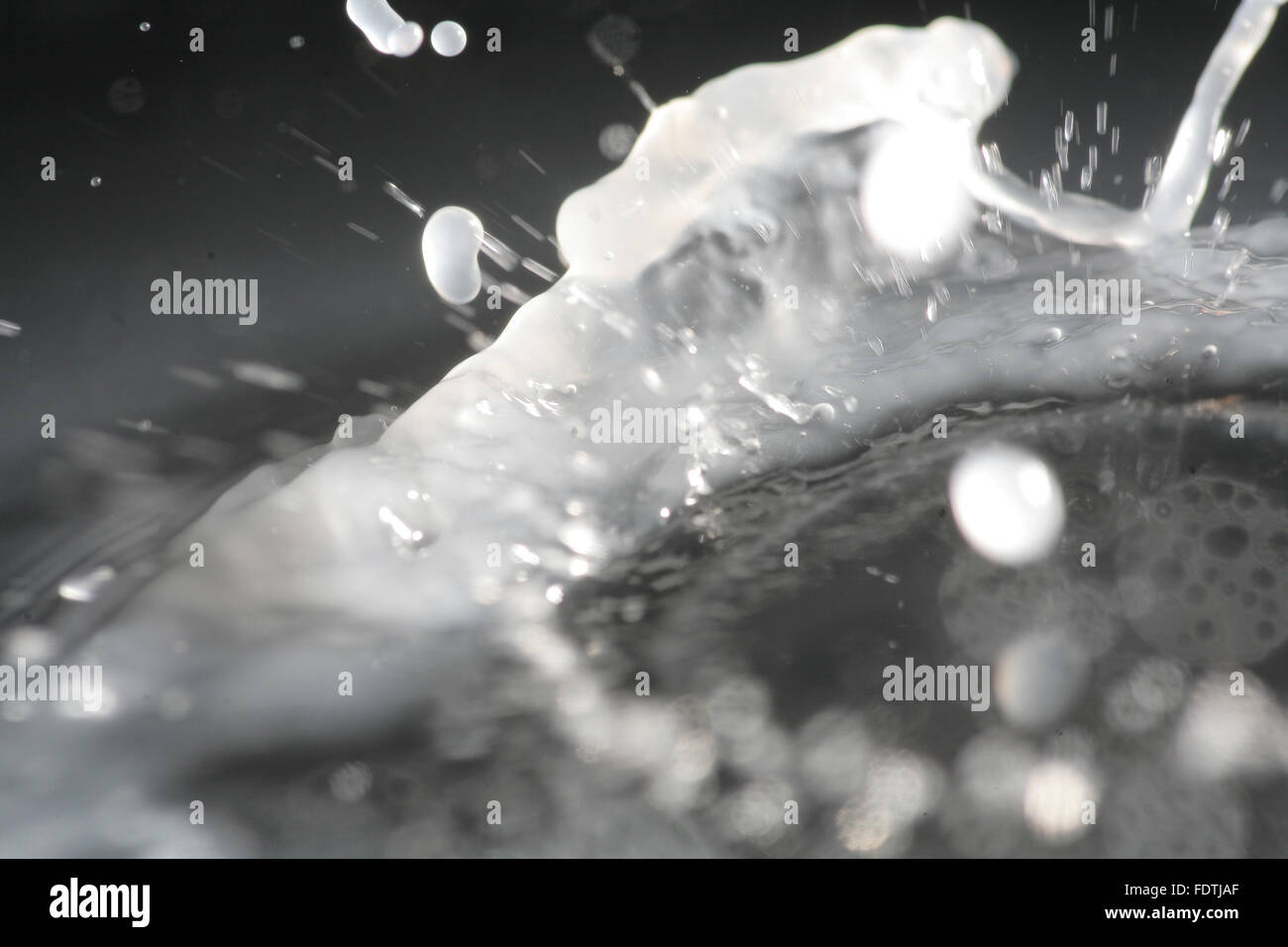 Macro image of milk drop splash Stock Photo - Alamy