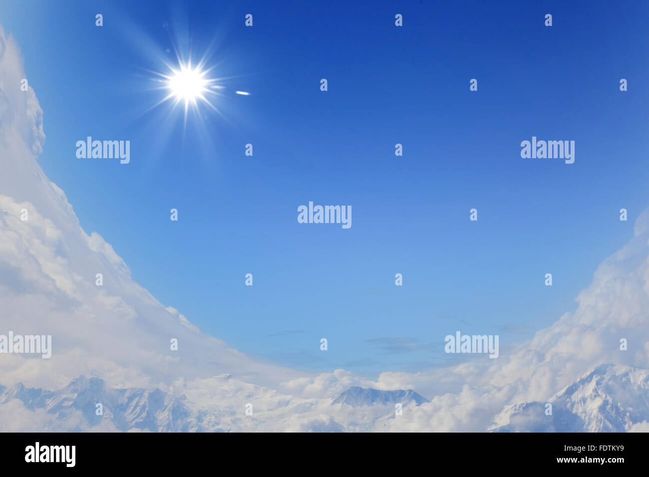 bright blue sky with sun shining and some clouds Stock Photo - Alamy