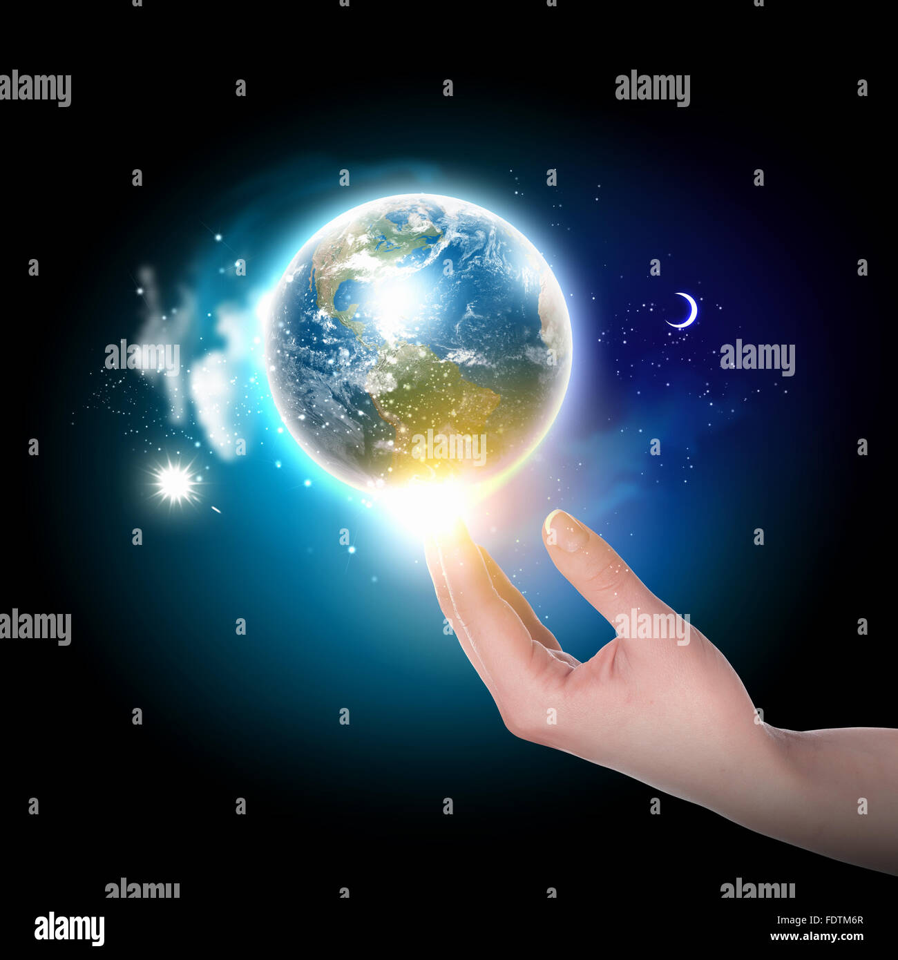 Human hand holding our planet earth glowing Stock Photo - Alamy