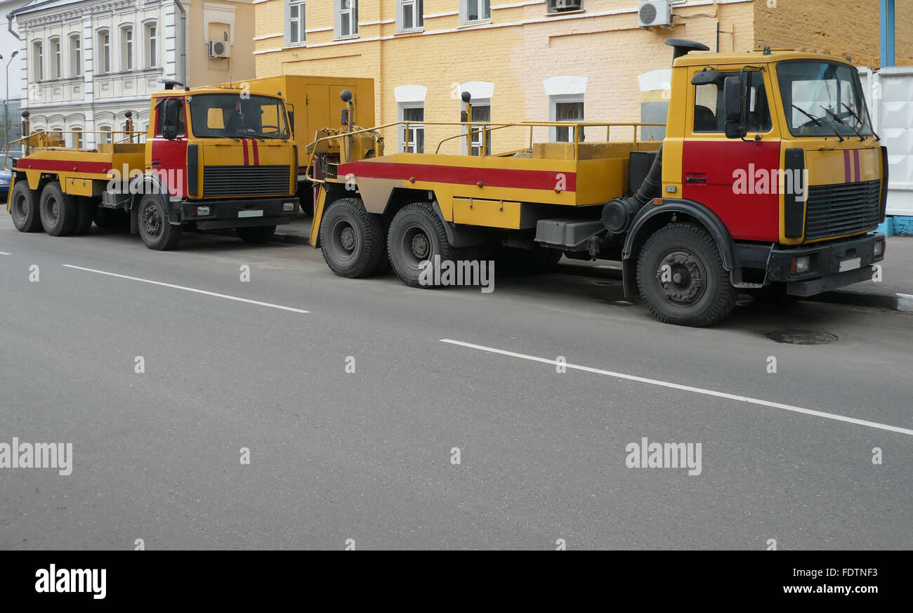 red-yellow emergency truck on asphalt road Stock Photo - Alamy
