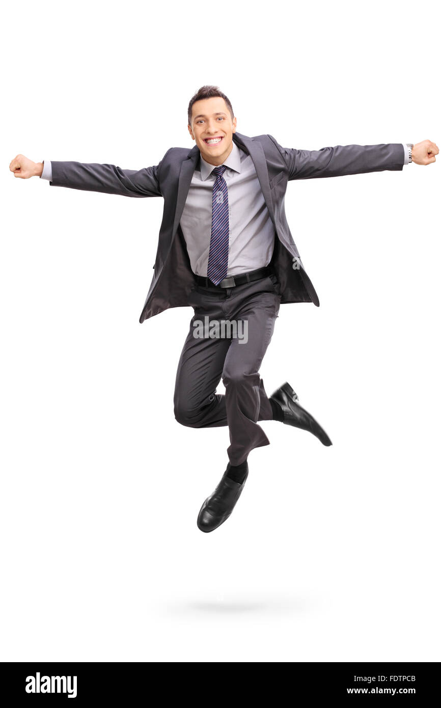 Full length vertical shot of a joyful businessman jumping out of ...
