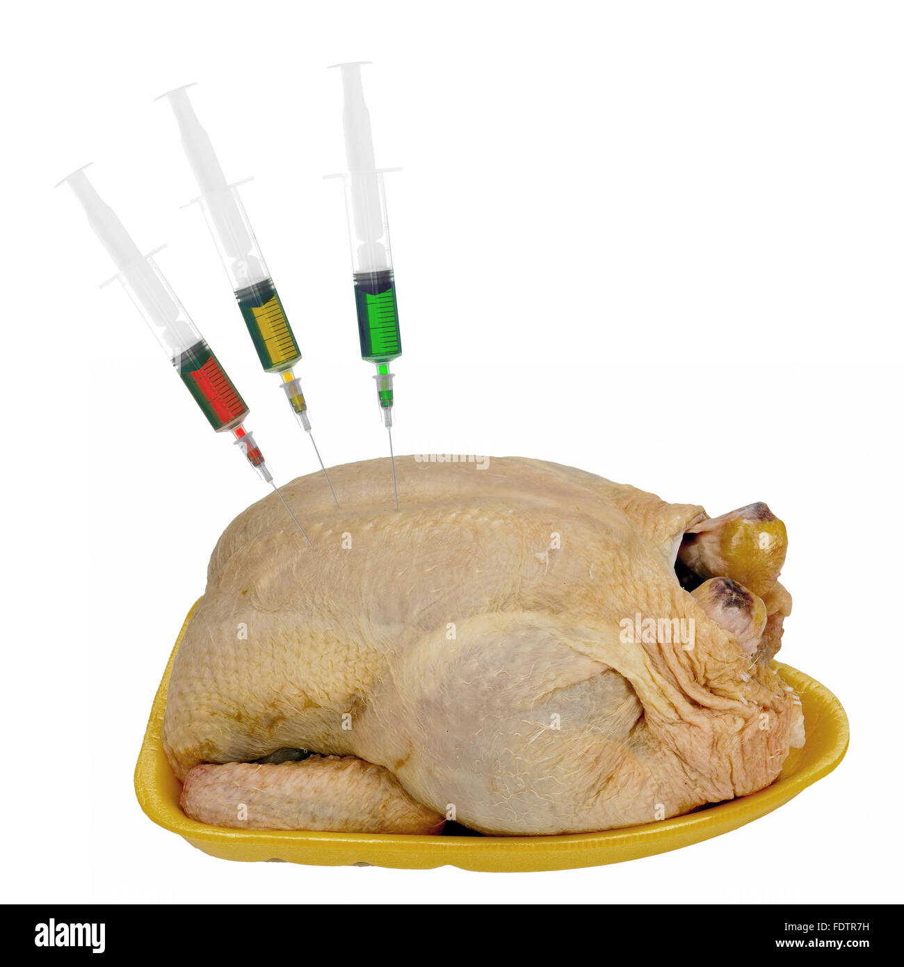 Supermarket chicken with syringes. Chemicals in food etc. Isolated on ...