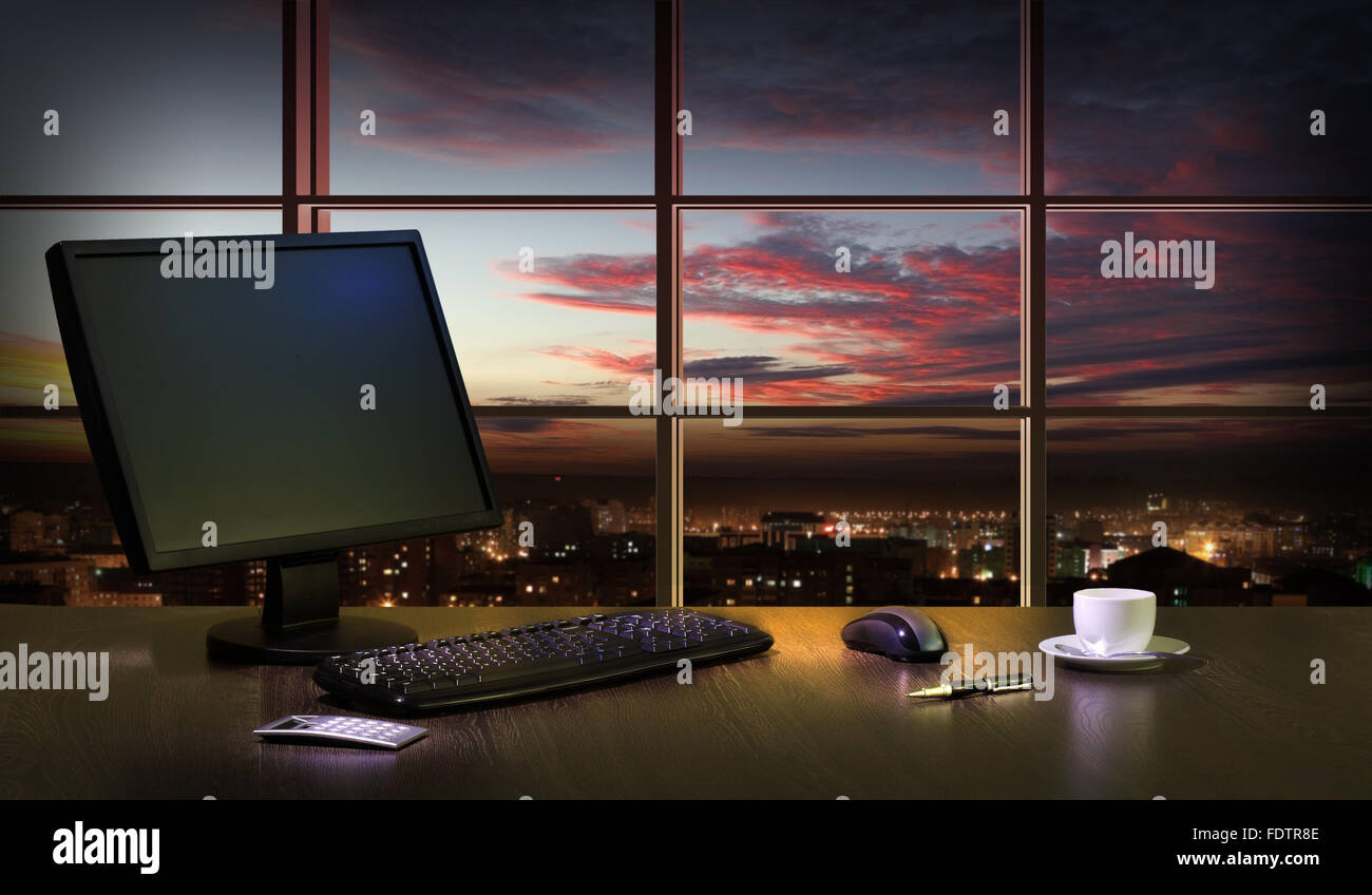 Work place in the office at night with a city view from window Stock ...