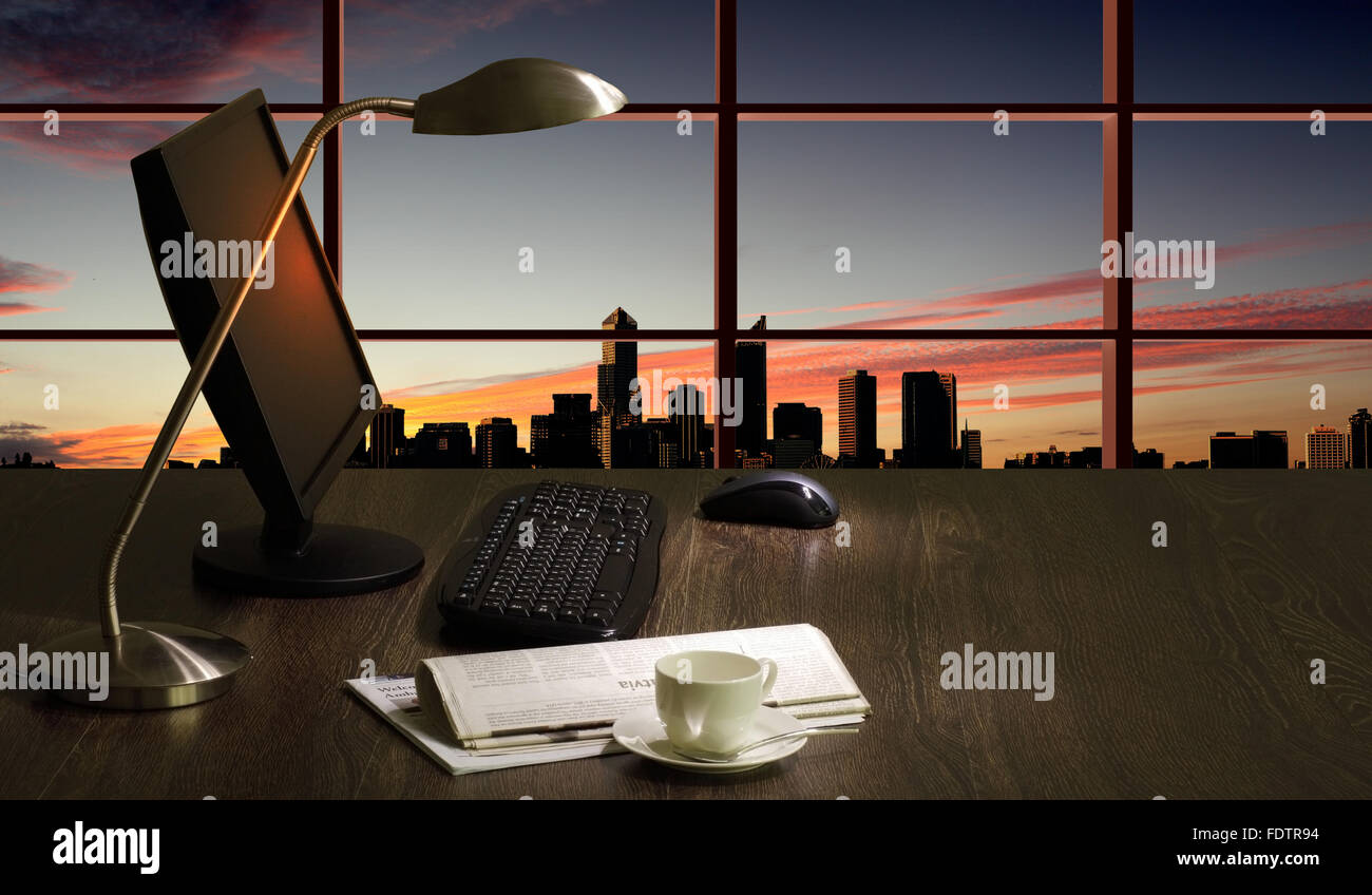 Work place in the office at night with a city view from window Stock ...