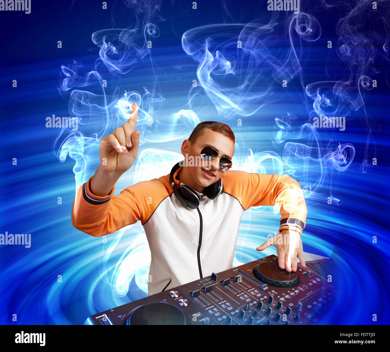 DJ with a mixer equipment to control sound and play music Stock Photo ...