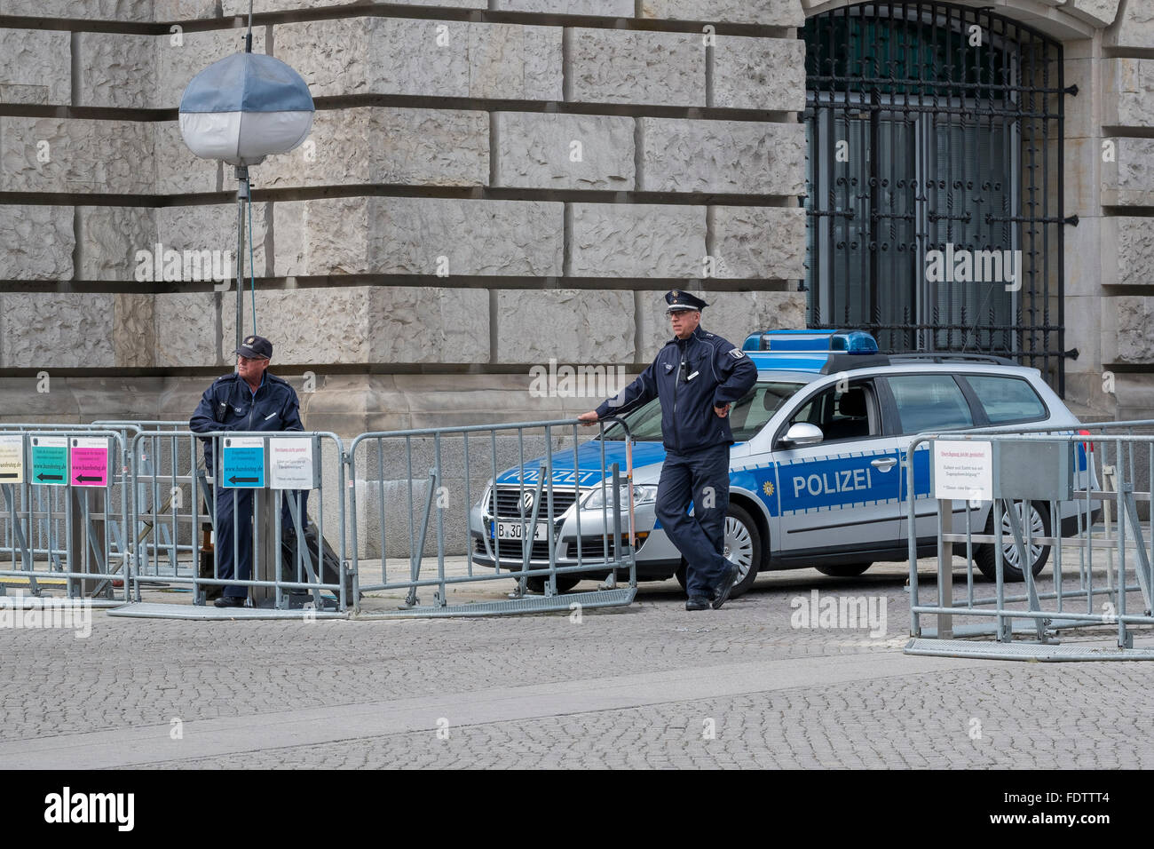 Two German Police Officers stand at a security checkpoint at the rear ...
