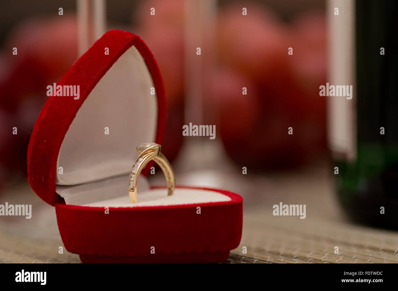 An engagement ring in a red box Stock Photo - Alamy