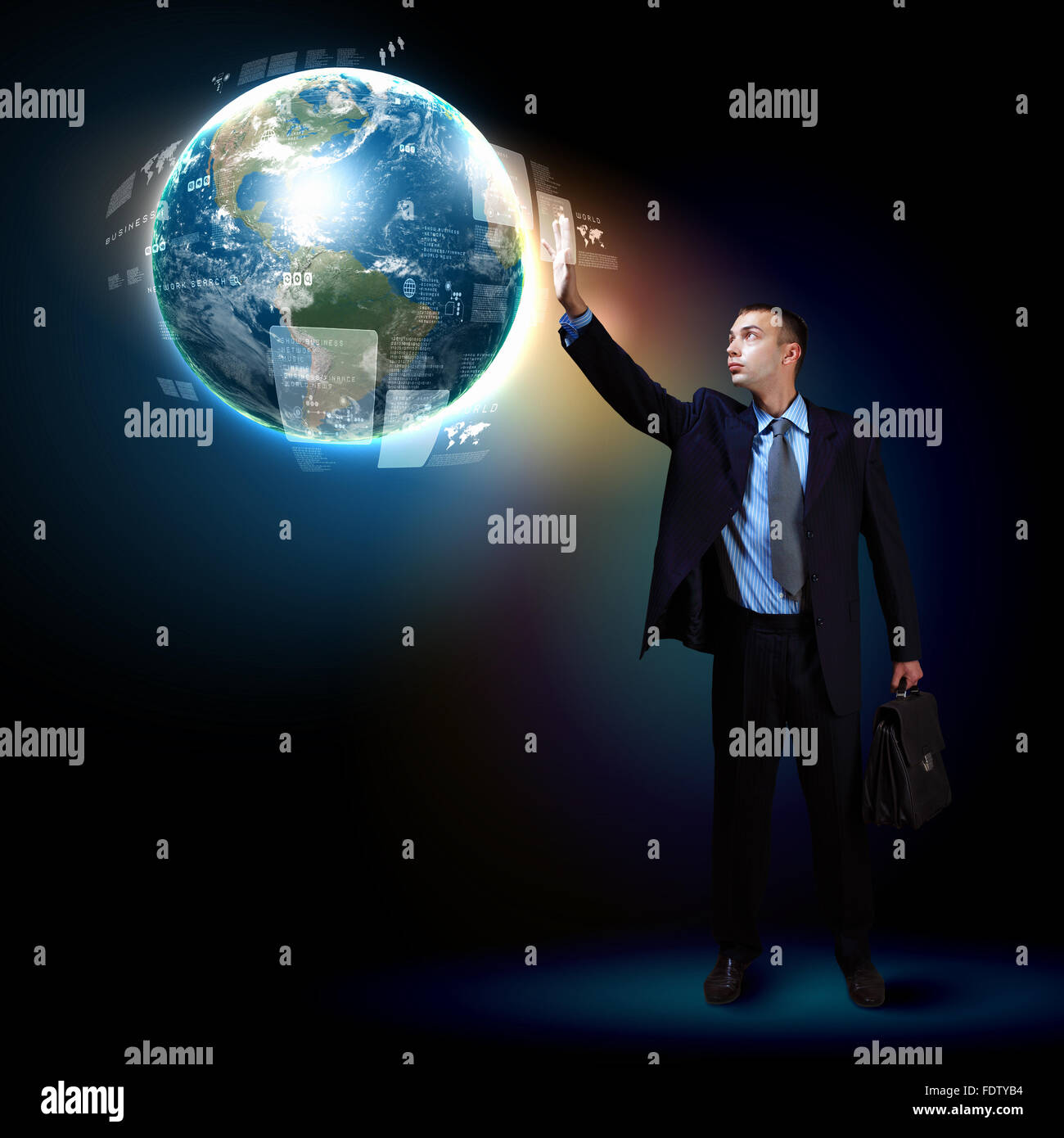 Businessman standing with modern technology symbols next to him ...