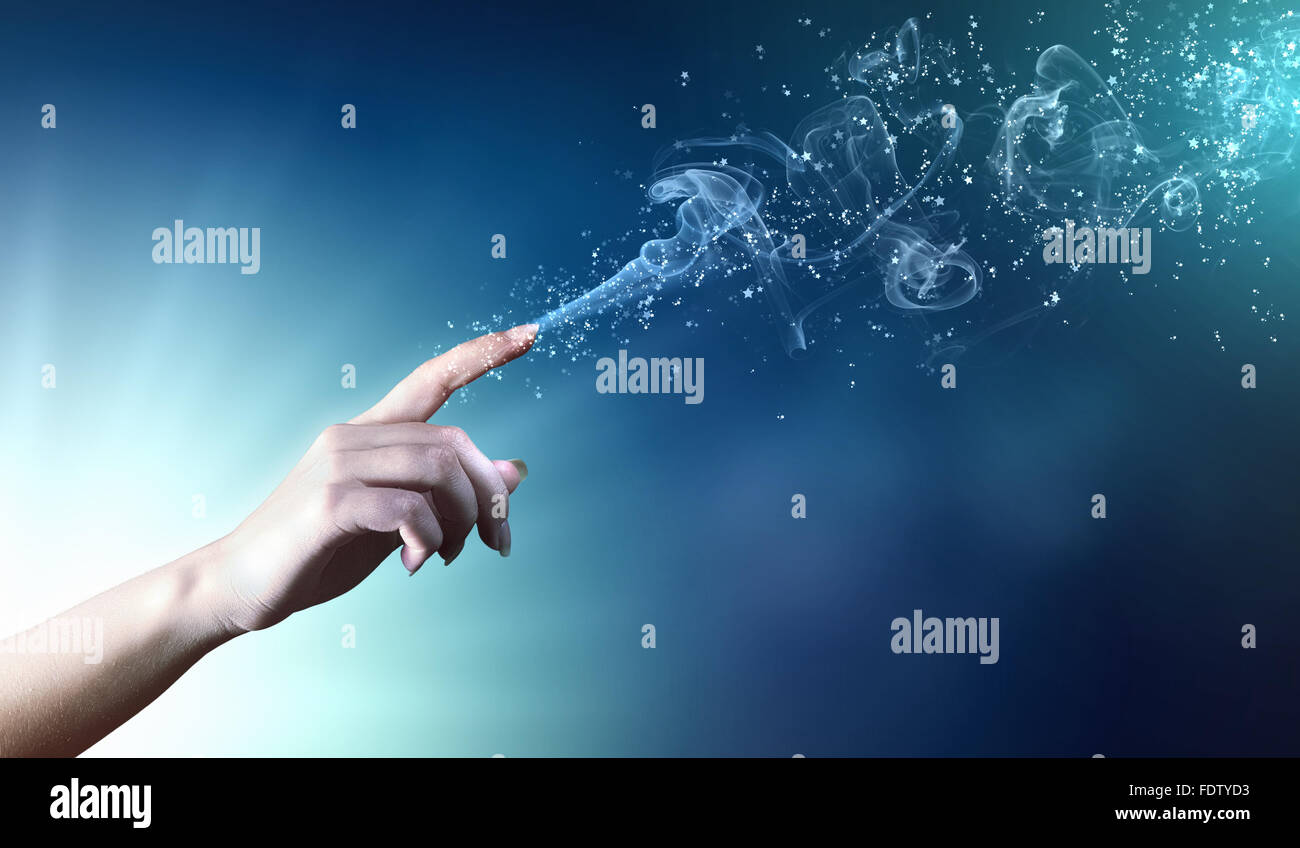 magical hand conceptual image with sparkles on colour background Stock ...