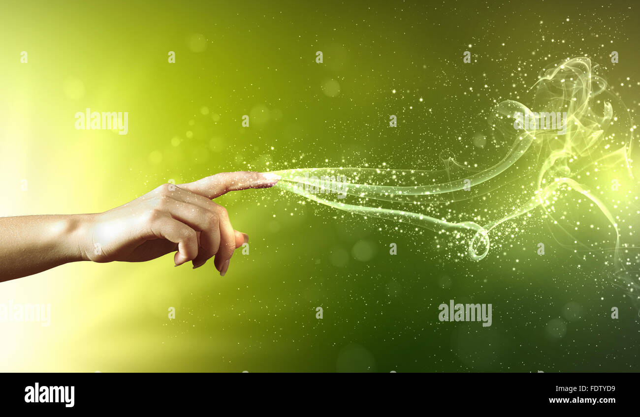 magical hand conceptual image with sparkles on colour background Stock ...