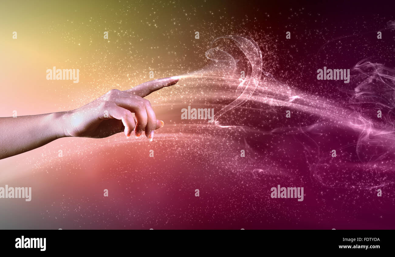 magical hand conceptual image with sparkles on colour background Stock ...