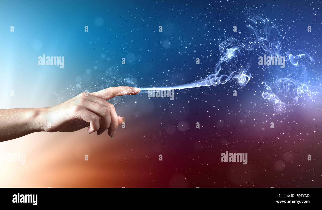 magical hand conceptual image with sparkles on colour background Stock ...