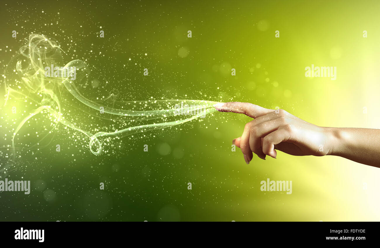 magical hand conceptual image with sparkles on colour background Stock ...