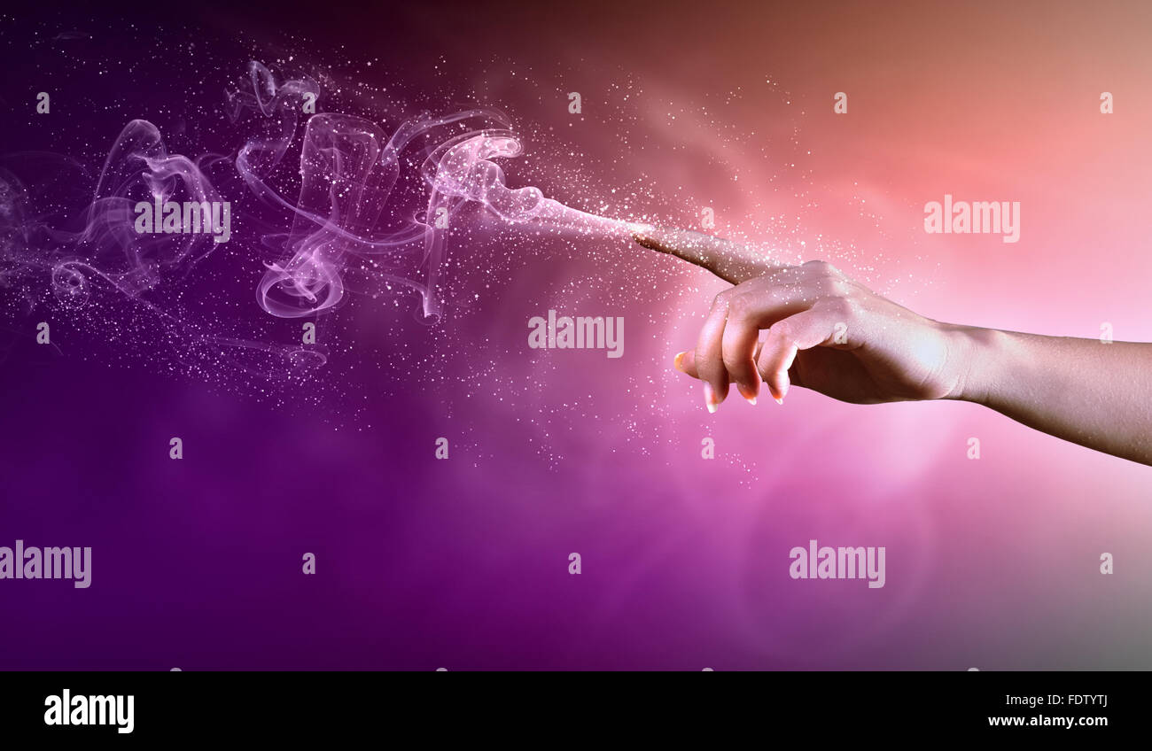 magical hand conceptual image with sparkles on colour background Stock ...