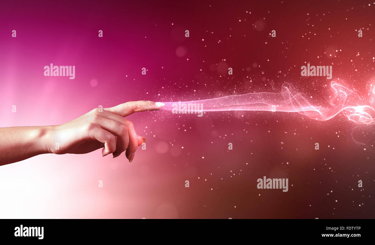 magical hand conceptual image with sparkles on colour background Stock ...