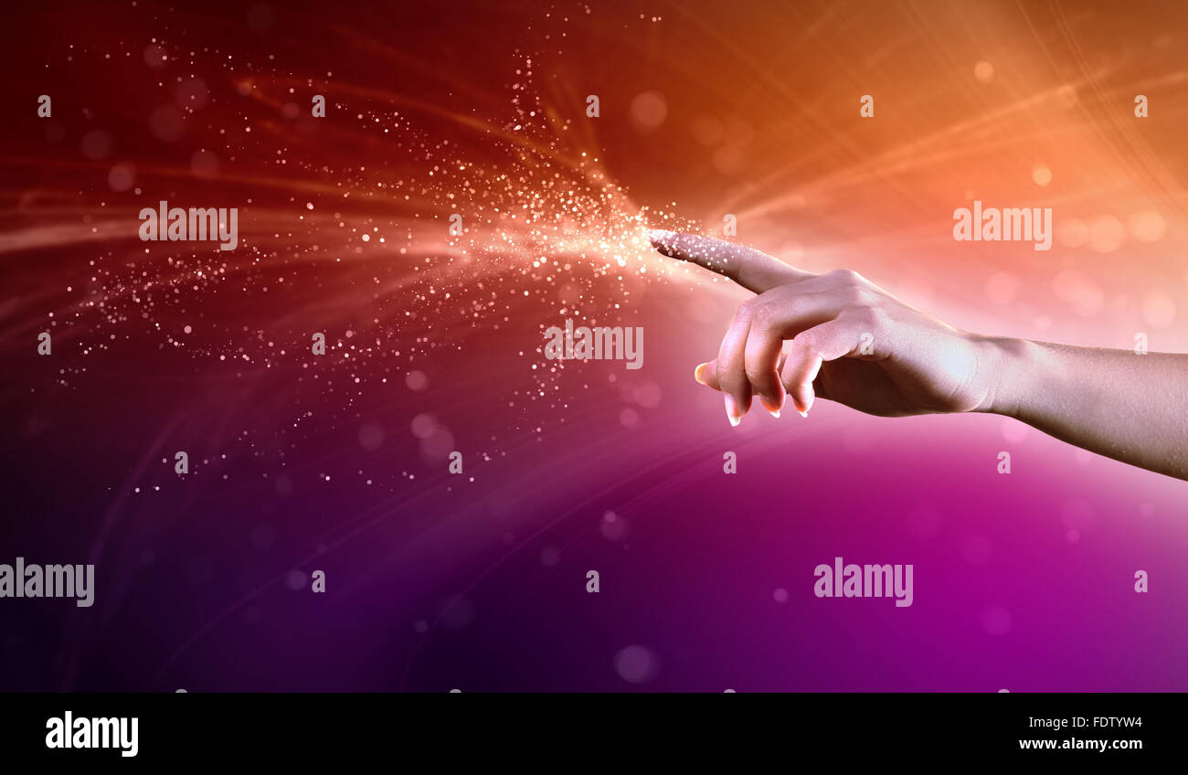 magical hand conceptual image with sparkles on colour background Stock ...