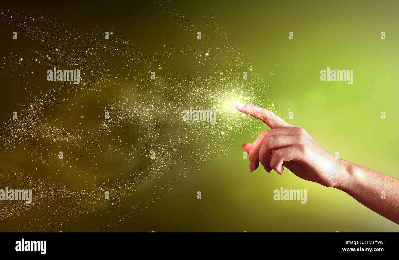magical hand conceptual image with sparkles on colour background Stock ...