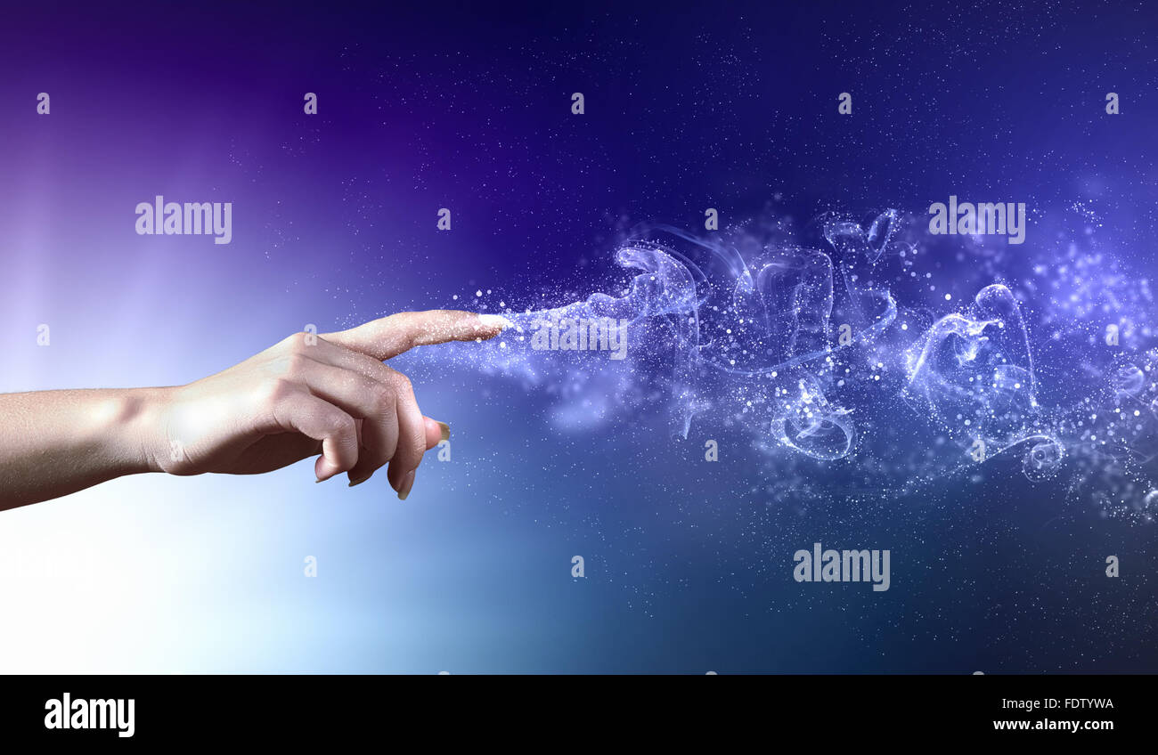 magical hand conceptual image with sparkles on colour background Stock ...