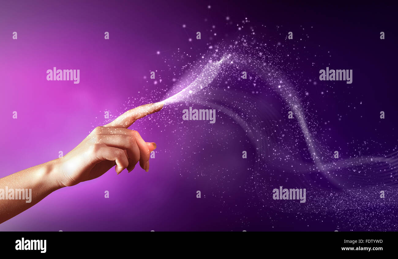 magical hand conceptual image with sparkles on colour background Stock ...