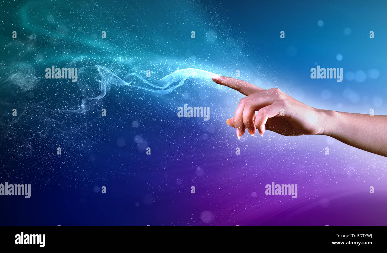 magical hand conceptual image with sparkles on colour background Stock ...