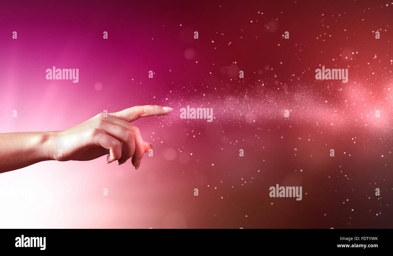 magical hand conceptual image with sparkles on colour background Stock ...