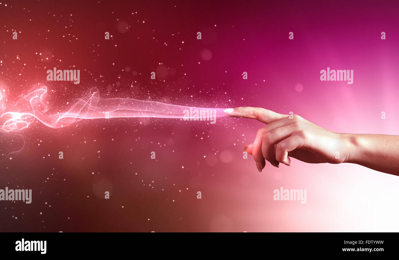magical hand conceptual image with sparkles on colour background Stock ...