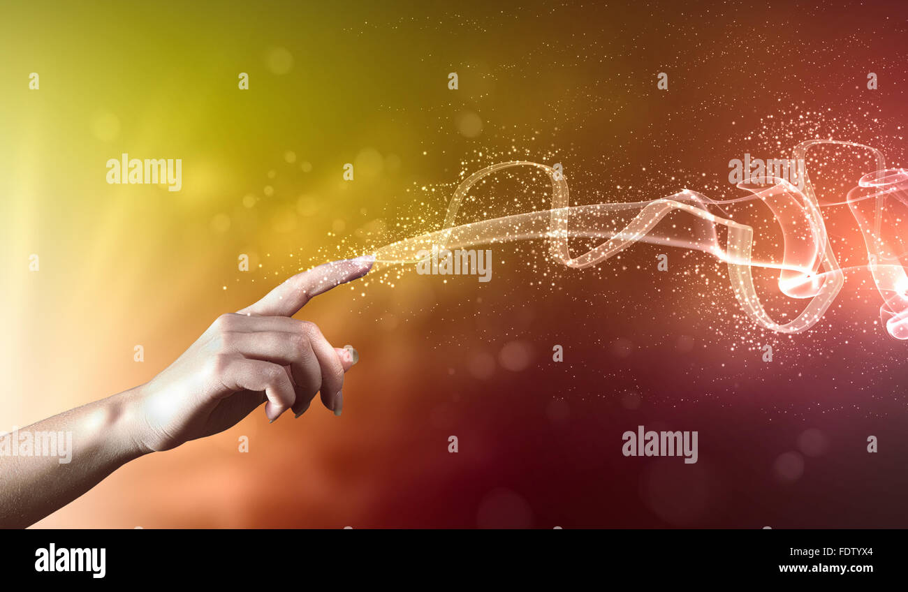 magical hand conceptual image with sparkles on colour background Stock ...