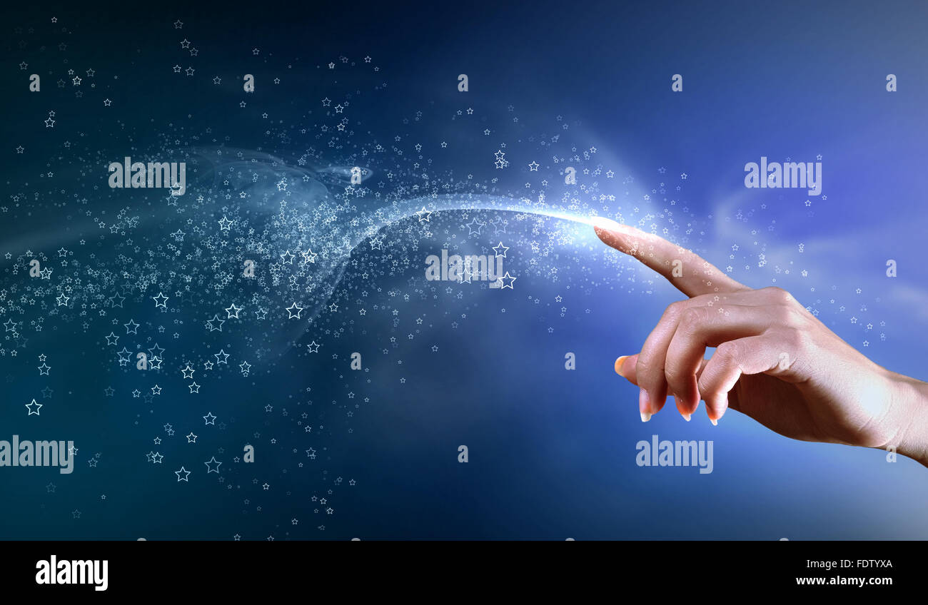 magical hand conceptual image with sparkles on colour background Stock ...