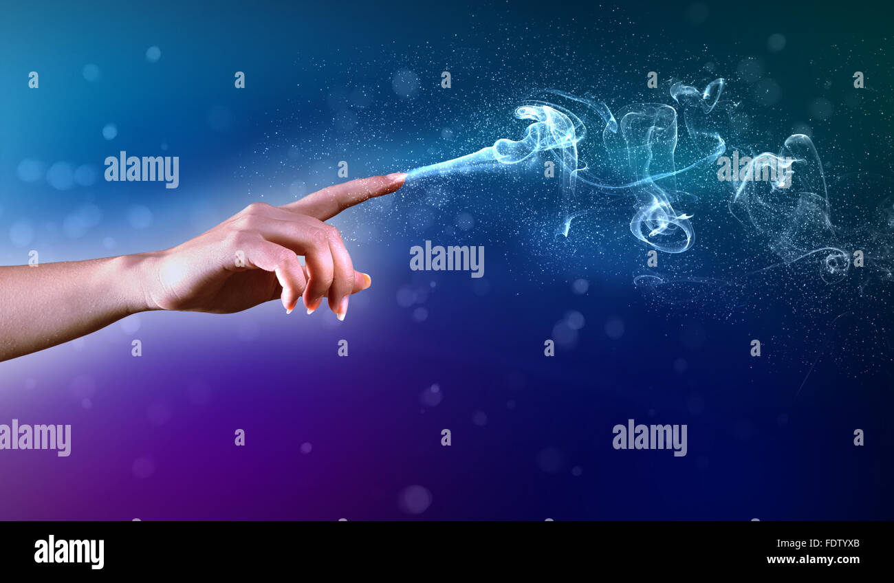magical hand conceptual image with sparkles on colour background Stock ...