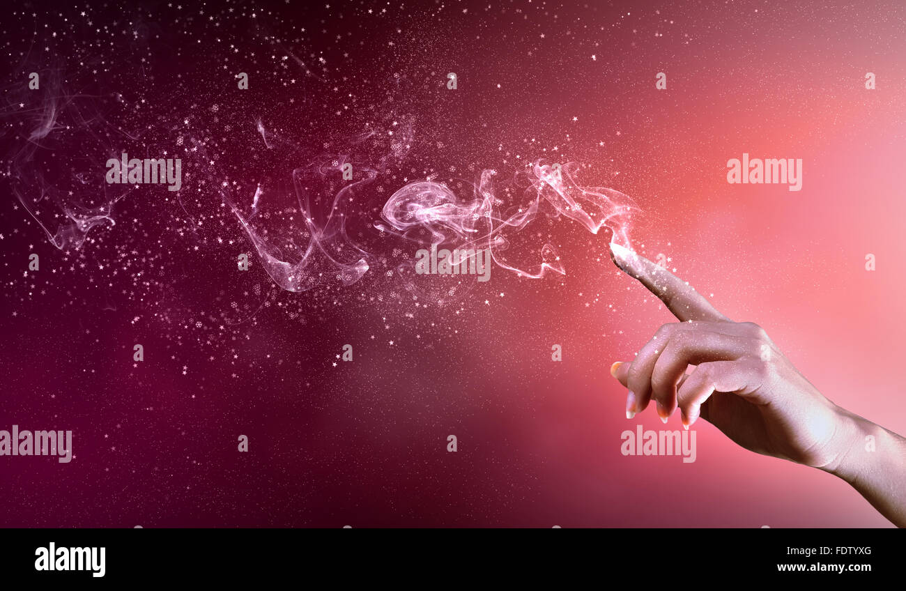 magical hand conceptual image with sparkles on colour background Stock ...