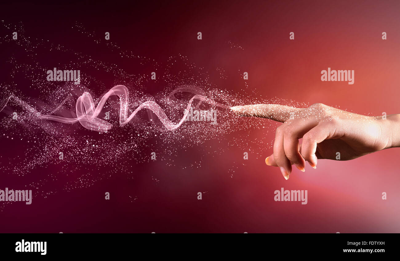 magical hand conceptual image with sparkles on colour background Stock ...