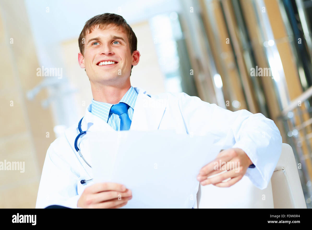 Portrait of friendly male doctor in hospital smiling Stock Photo - Alamy