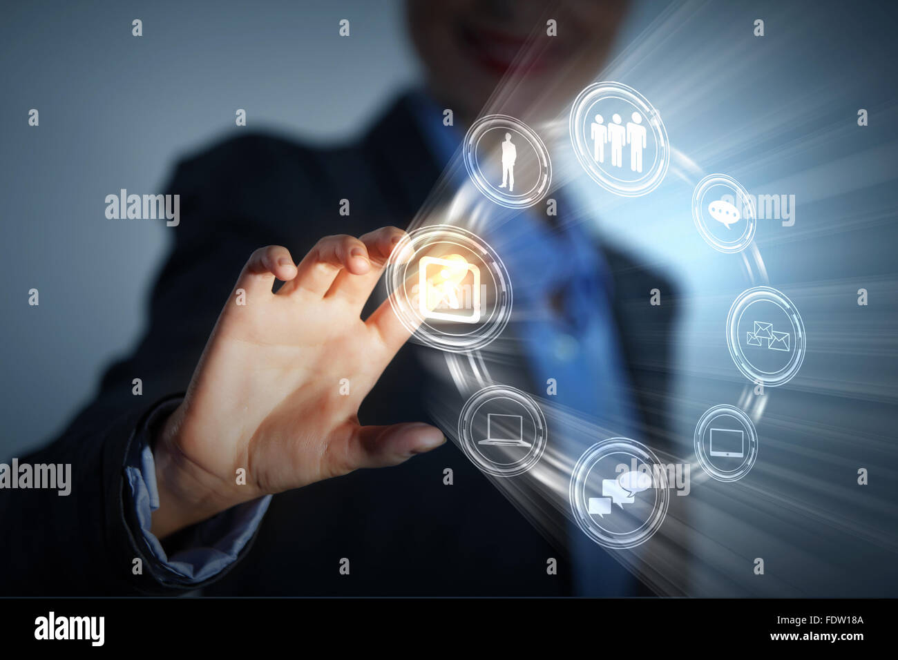Business person pushing symbols on a touch screen interface Stock Photo ...