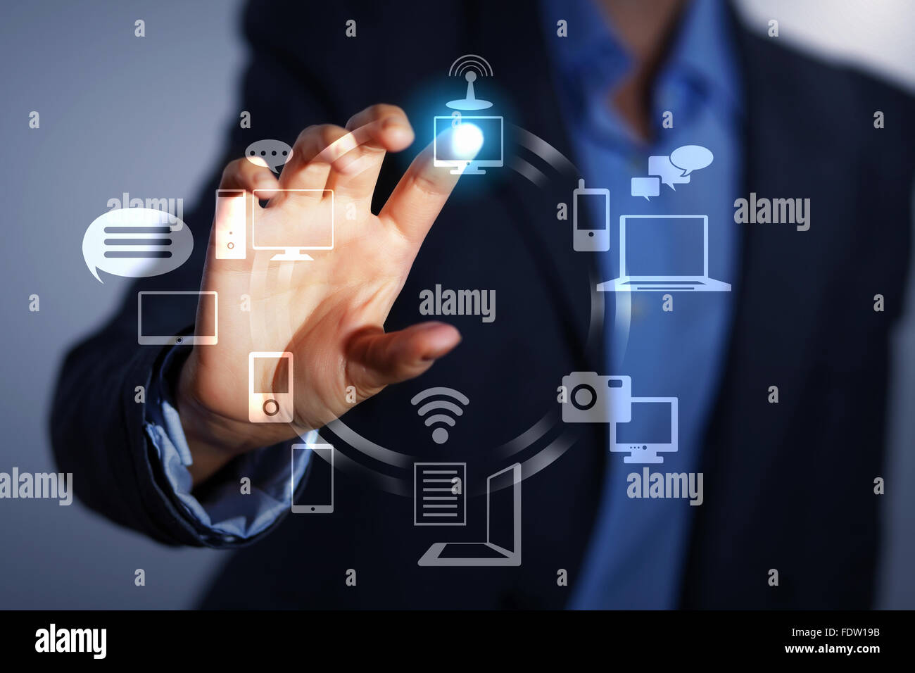 Business person pushing symbols on a touch screen interface Stock Photo ...