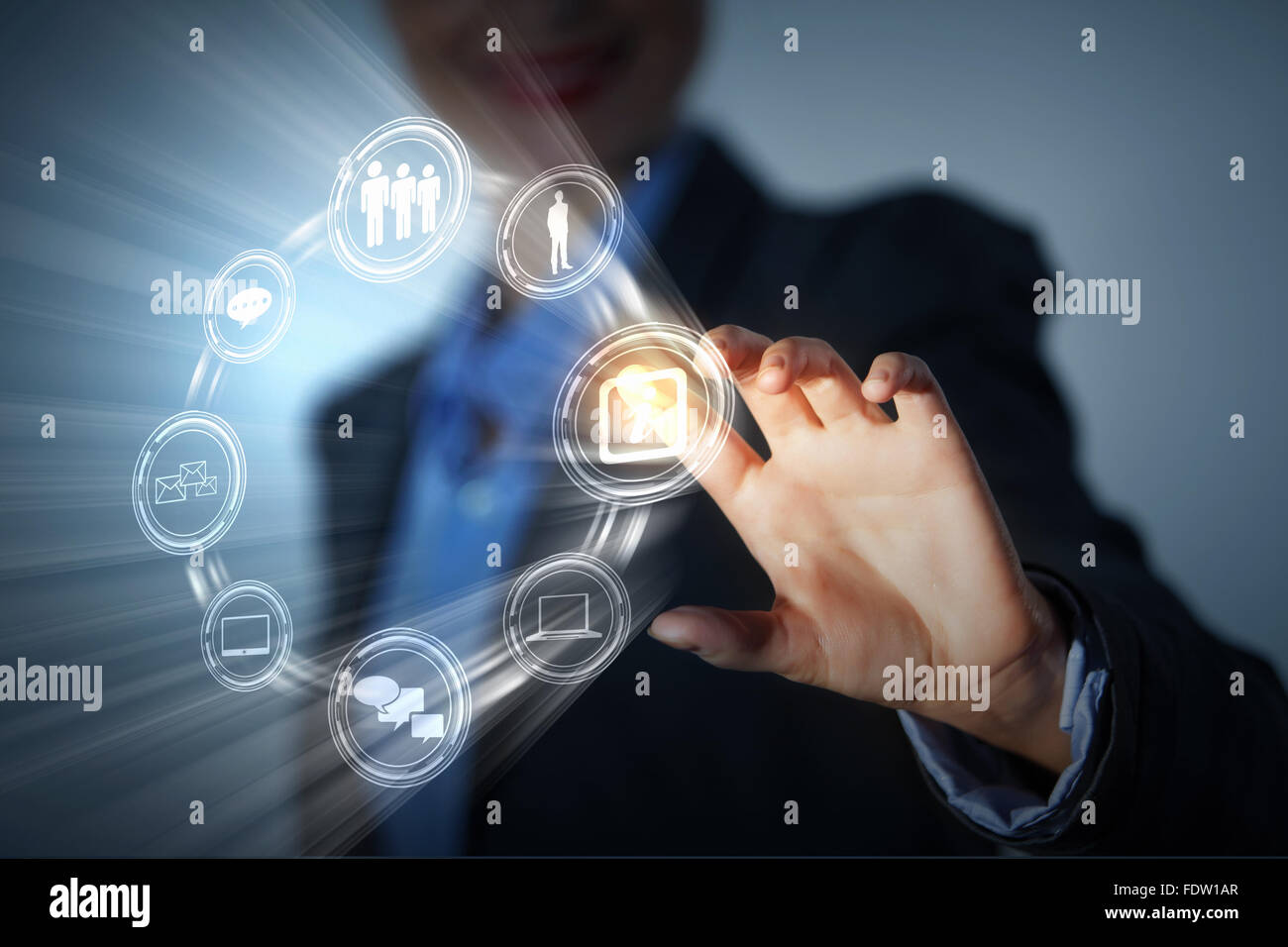 Business person pushing symbols on a touch screen interface Stock Photo ...