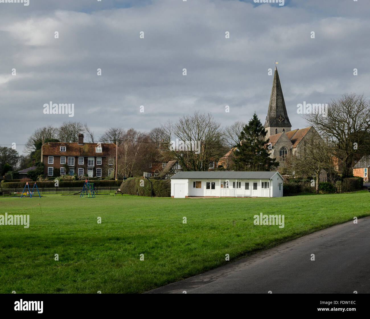 Woodchurch cricket pavillion on the village green with All Saints ...